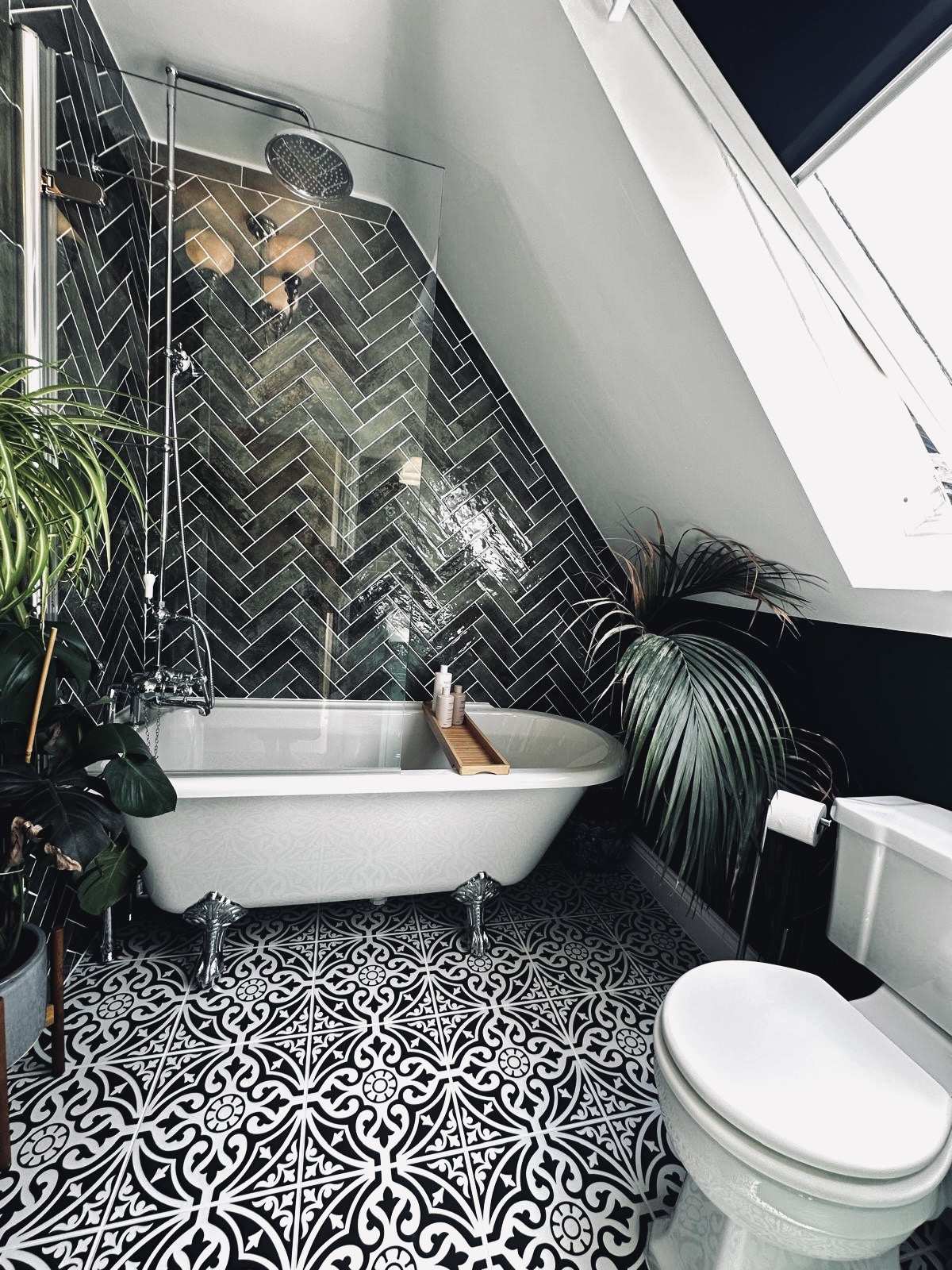 Luxury Bathroom Oasis with Green Herringbone Tiles and Bold Monochrome ...